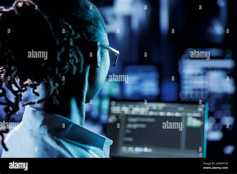 trained admin running code and programming on laptop troubleshooting and upgrading high tech