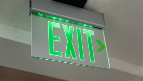 Premium Photo Exit Sign Glows Brightly Symbolizing Safety And Guidance In Emergency Situations