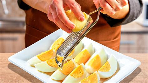 Top Hard Boiled Eggs With Shredded Cheese And Bake For A Quick Snack