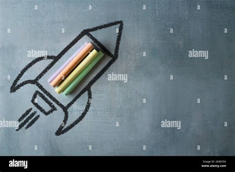 Sketch Of Rocket Ship Launch Made With Colorful Chalk On Chalkboard With Copy Space Creative