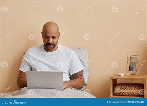 Adult Black Man Using Laptop In Bed In Morning Stock Image Image Of Laptop Bald 291536711