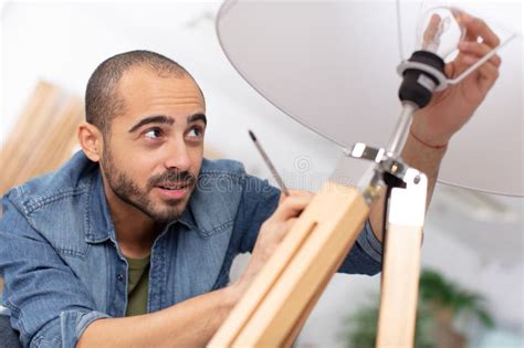 Man Changing Light Bulb In Lamp At Home Stock Image Image Of Electrical Person 308148589