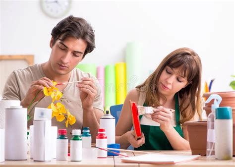 Couple Decorating Pots In Workshop During Class Stock Image Image Of