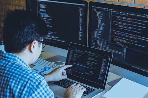 Soft Focus Blur Top View Developer Programming Hand Pointing And Coding Technology Website