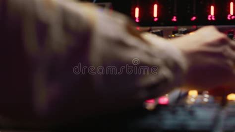 Audio Technician Uses Mixing Console And Faders In Control Room Stock