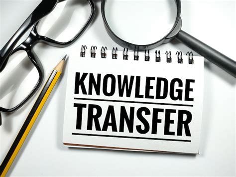 Premium Photo Word Knowledge Transfer On Notebook With Magnifying