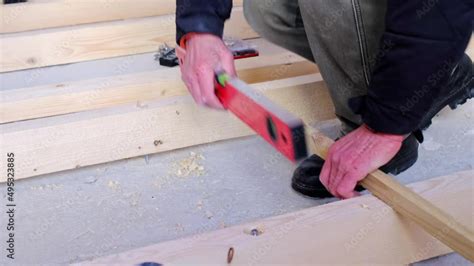 Installation Of A Wooden Floor Log On Studs At The Hydraulic Level Installation Of The Rough
