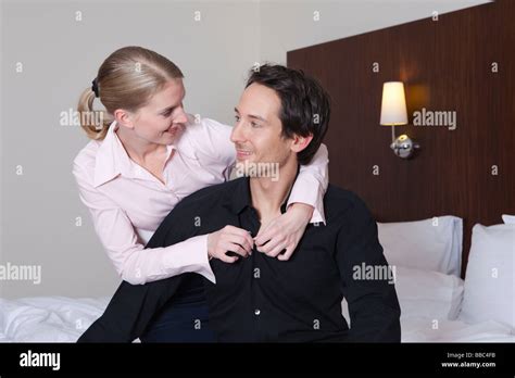 Couple In Hotel Room Getting Undressed Stock Photo Alamy