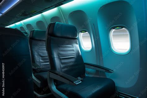 Airplane Flight Safety Concept Emergency Exit Seat Row In Airplane Exit Sign Light Over