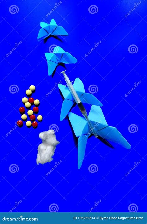 Syringe And Pills On Blue Paper Butterflies With Blue Background