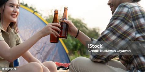 Asian Husband And Wife Drink While Camping In The Jungle Adventures New