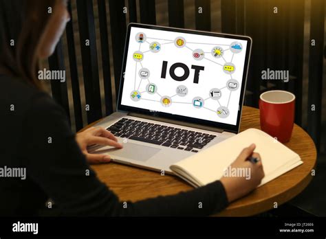 IOT Business Man Hand Working And Internet Of Things IoT Word Diagram As Concept Use Browsing