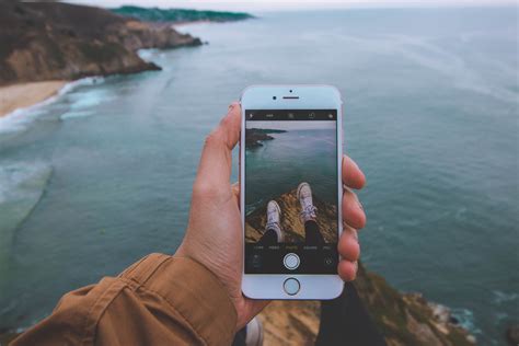 Hand Holding Phone And Mobile Phone 4k Hd Wallpaper