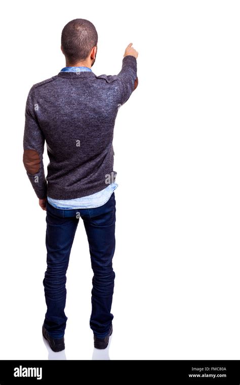 Casual Man Pointing To Copyspace Isolated Over A White Background Stock Photo Alamy