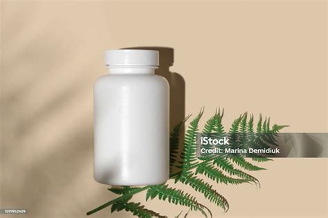 흰색 보충 병입니다 의학 모형 빈 라벨 비타민 템플릿입니다 천연 유기농 바이오 알약 항아리 베이지색 스튜디오 컬러 배경입니다 명확한 포장 Top View 트렌디한 제품