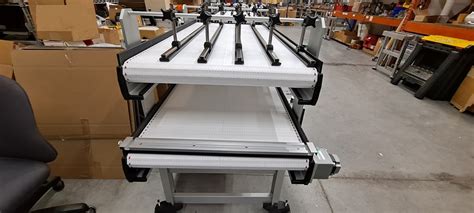 multi lane over under conveyor robotic interface