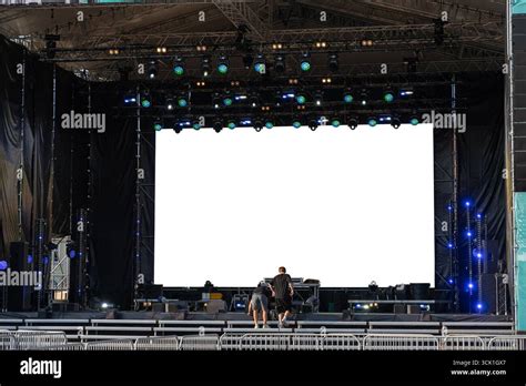 Stage Crew Setting Up Concert Production With Massive Led Screen Sound