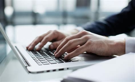 Premium Photo Closeup Image Of A Man Working And Typing On Laptop Computer Keyboard