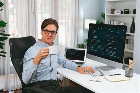 It Developer Looking Camera Holding Coffee Cup With Coding On Pc Pecuniary Stock Image