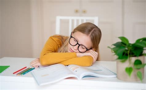 Premium Photo Portrait Of Teen Girl Sleeping At Desk Tired After