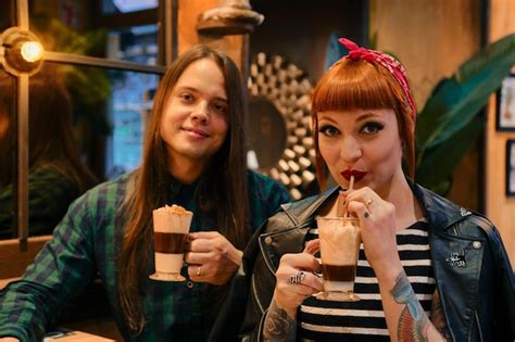 Premium Photo Two Friends Posing Happily While Having A Coffee And