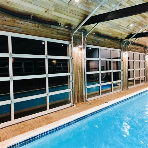 Indoor Pool With Glass Garage Doors