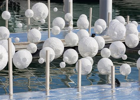 Sensual Wave Installation Illuminates An Empty Dock At French Harbour
