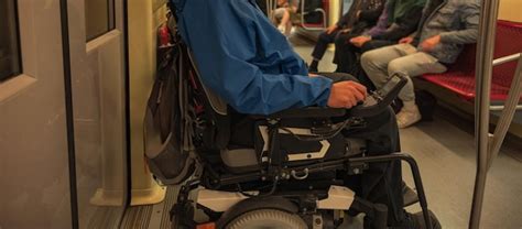 Premium Photo Man With Disability With Electric Wheelchair On Train