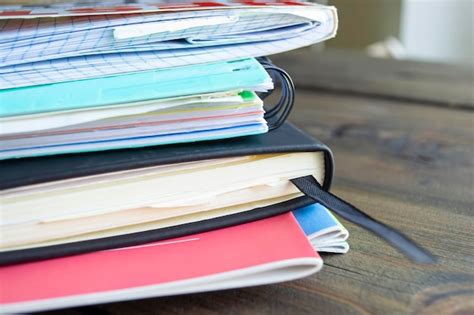 Premium Photo A Stack Of Notebooks Closeup Notebooks On A Spring Lie On Top Of Each Other A