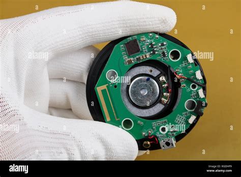 A Technician Controls The Quality Of A Bluetooth Module For Mobile Audio Devices Mass