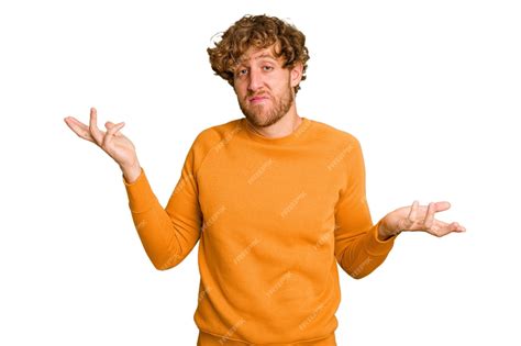Premium Photo Doubting And Shrugging Shoulders In Questioning Gesture