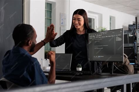 Premium Photo Happy System Engineers Celebrating Successful Code Script Compiling Doing