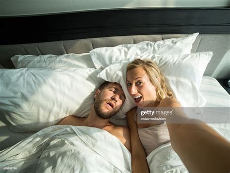 Girlfriend Takes Selfie Of Boyfriend Sleeping In Bed High Res Stock