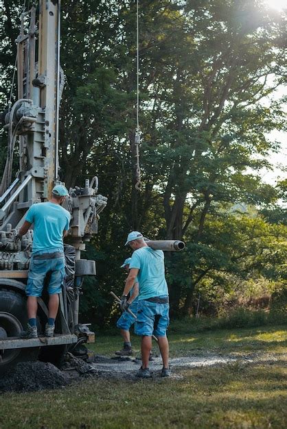 Premium Photo Water Well Drilling Rig Preparing To Boring Dowin Into