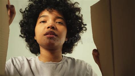 Inside Of Cardbox Bottom View African Girl Unpacking Delivery Looking