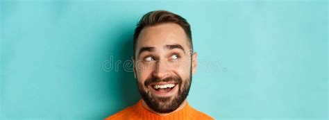 Headshot Of Handsome Caucasian Man Looking At Upper Left Corner Logo