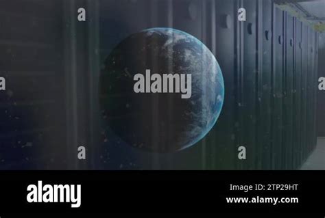 animation of snowfall and rotating globe over data server racks in