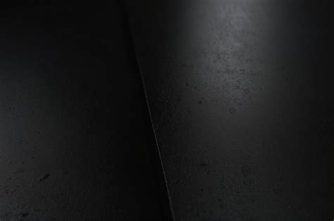 Glossy Matte Black Surface With Smooth Finish And Refined Dark Texture