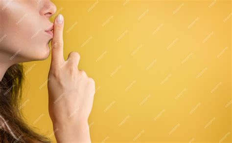Premium Photo Calm Young Caucasian Lady Puts Finger To Lips Making