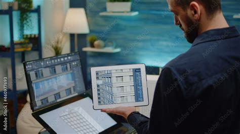 Architect Holding Digital Tablet With Building Model For Construction Layout In Office Man
