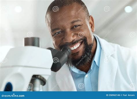 Nothing Gets Passed Me A Handsome Mature Scientist Using A Microscope To Analyse A Sample In