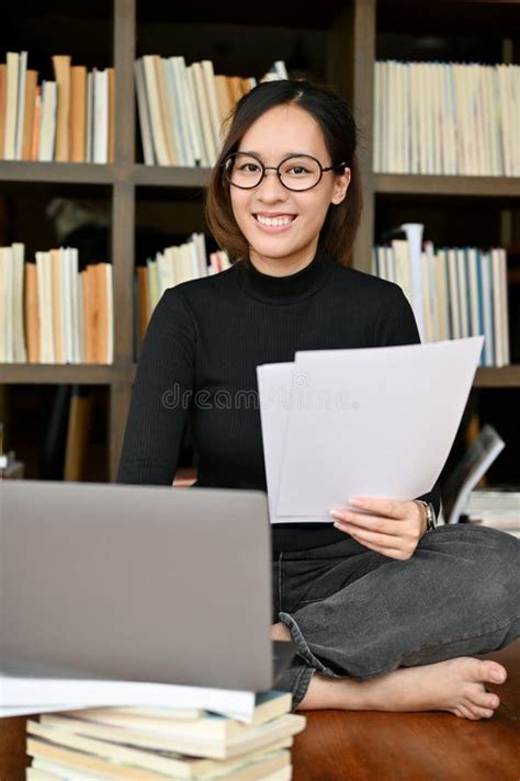 Nerd Young Asian Female College Student Doing Her Research In The