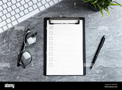 Clipboard With Checkboxes Computer Keyboard Eyeglasses And Pen On