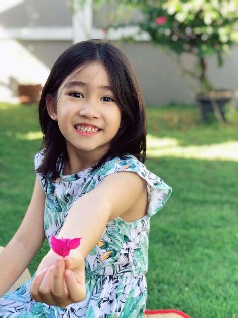 Premium Photo Portrait Of Cute Girl Playing In Park