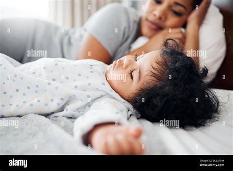 Dreams Flashing Before Her Eyes A Mother Watching Her Daughter Sleep Stock Photo Alamy