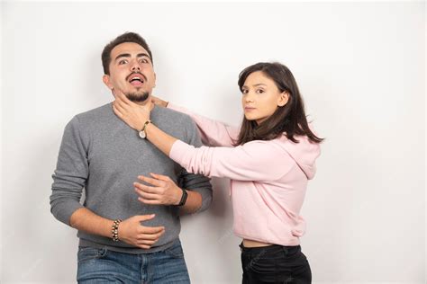 Free Photo Angry Woman Playfully Choking His Boyfriend