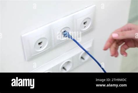 Person Get Wi Fi Cable From Wall Outlet Blocking And Turning Off Internet Stock Video Footage