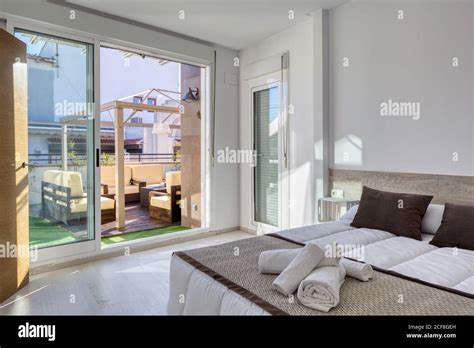 Interior Of Empty Beautiful Bedroom In Modern Style With Big Balcony In