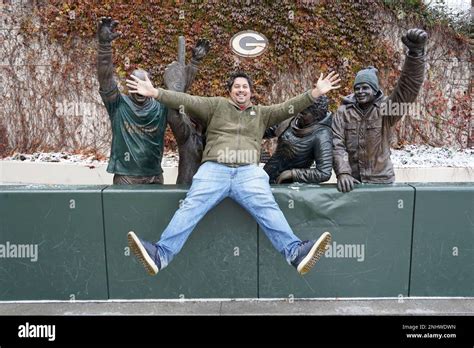 Max Siker Poses With The Lambeau Leap Statue At Lambeau Field Wednesday Nov 16 2022 In
