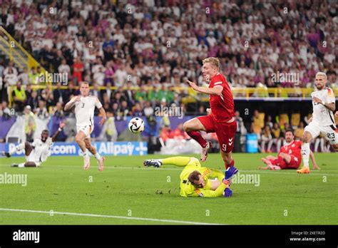 Germany Goalkeeper Manuel Neuer Saves At The Feet Of Denmarks Rasmus